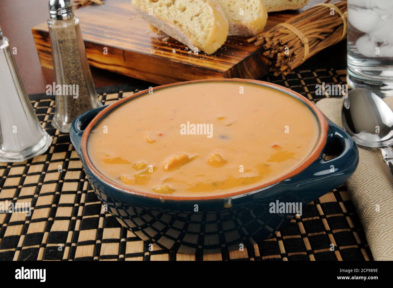 A bowl of creamy gouda cheese bisque with chicken Stock Photo - Alamy