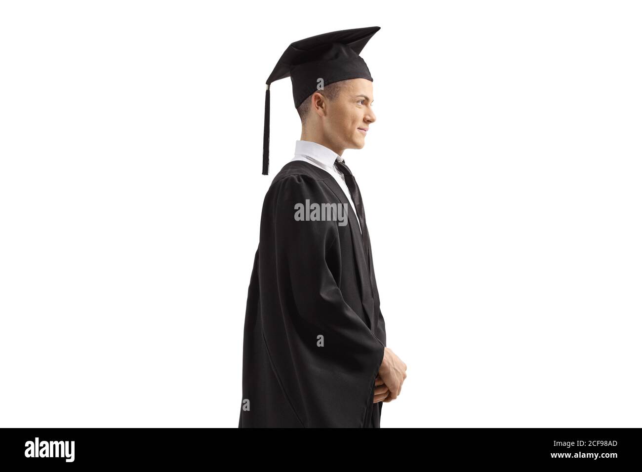 Graduate male student standing isolated on white background Stock Photo ...