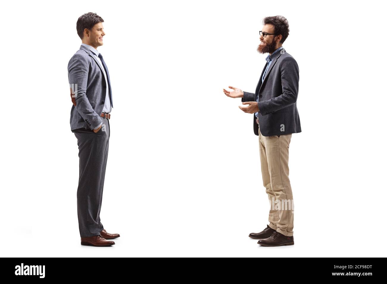Full length profile shot of two male colleagues having a conversation ...