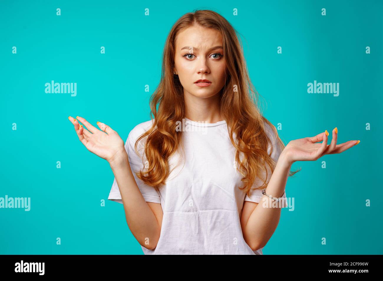 Young caucasian girl making do not know sign Stock Photo - Alamy