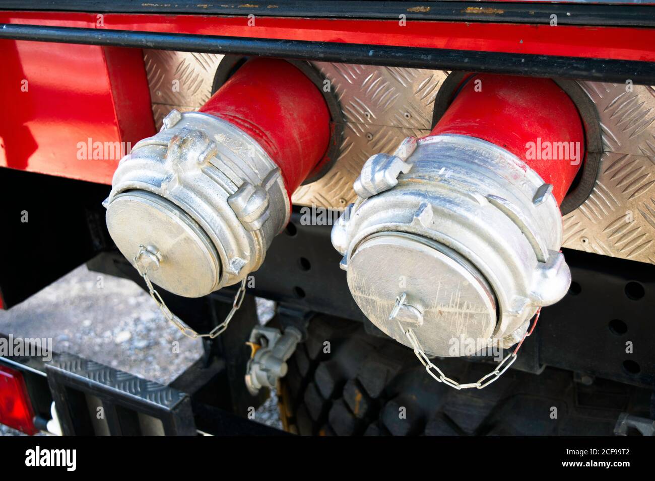 two plugs covering fire pump connections for intake of water from a ...