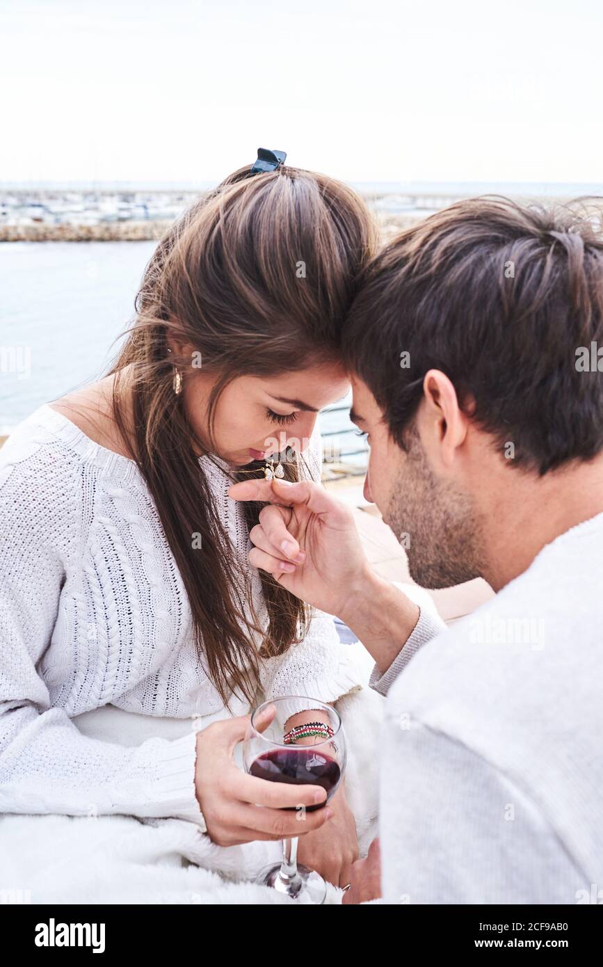 From Above Side View Of Affectionate Tender Young Couple Hugging And
