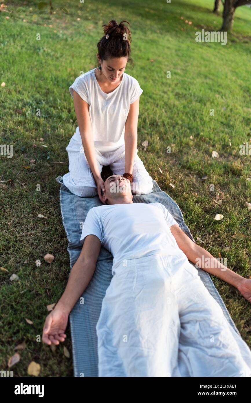 Woman meditating sitting calm field hi-res stock photography and images ...