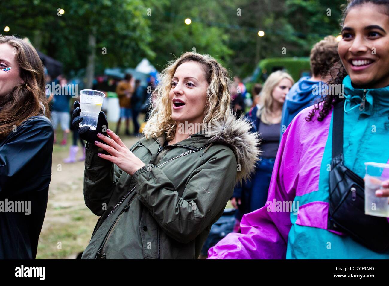 Group of friends watching live music at We Are Not a Festival socially ...