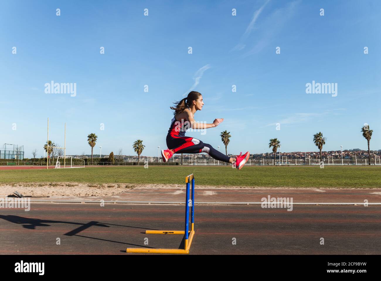 Runner jumping leaping hi-res stock photography and images - Alamy