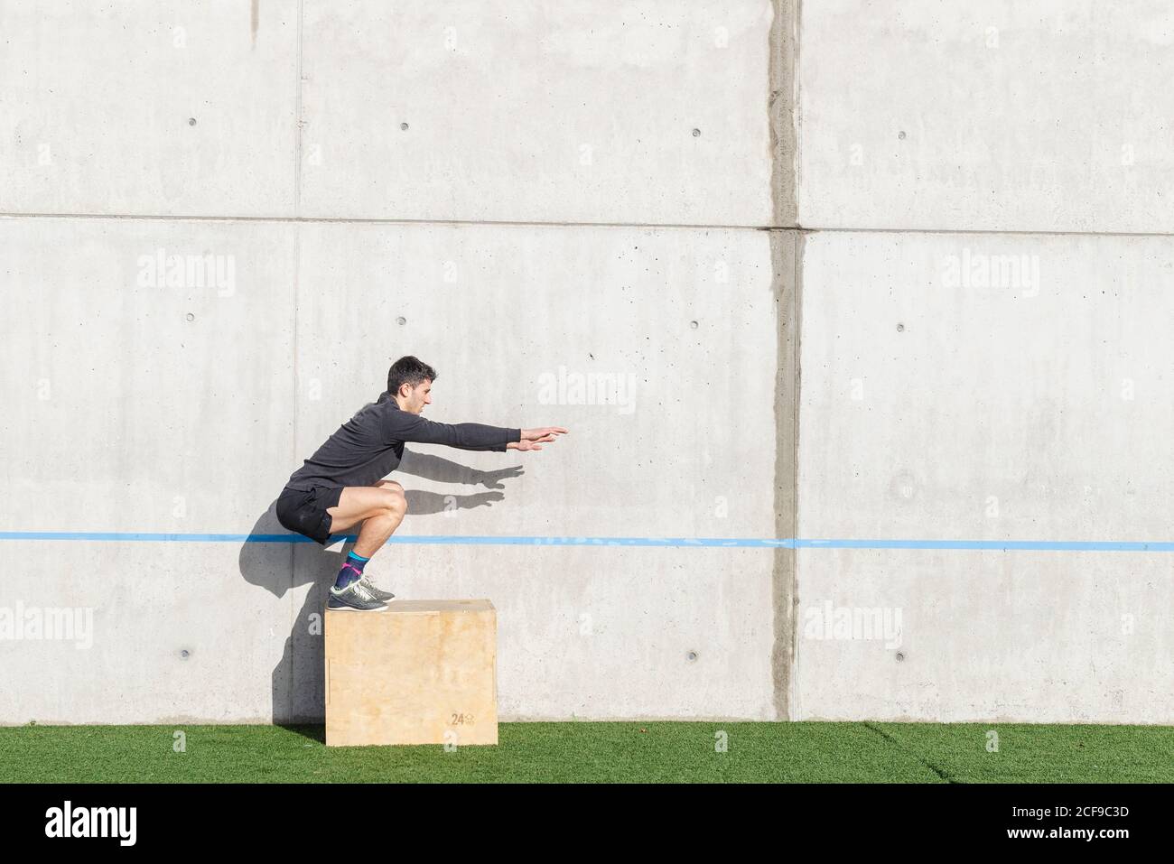 Young man jumping on box hi-res stock photography and images - Alamy