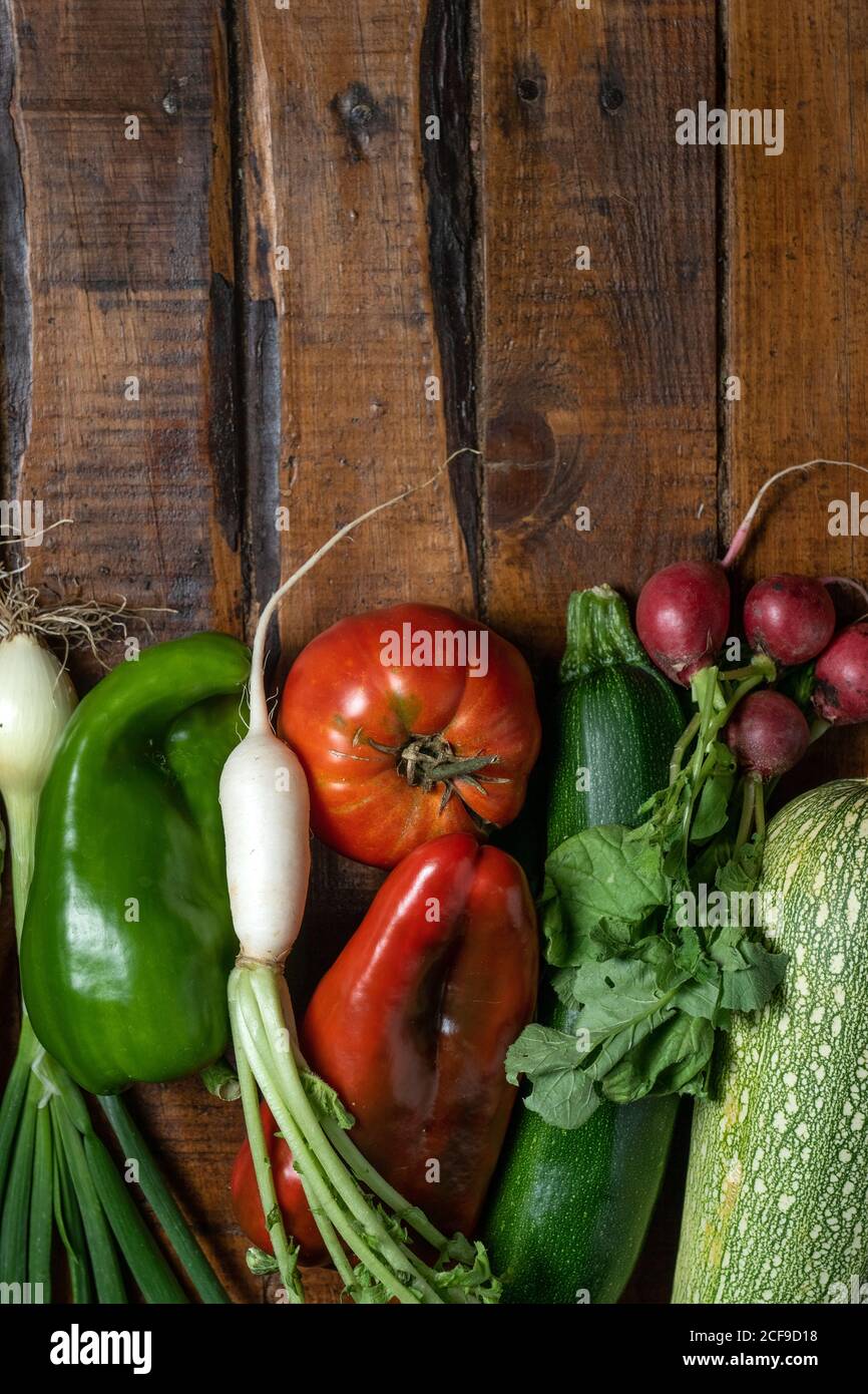 Top view composition of various fresh organic vegetables with green ...