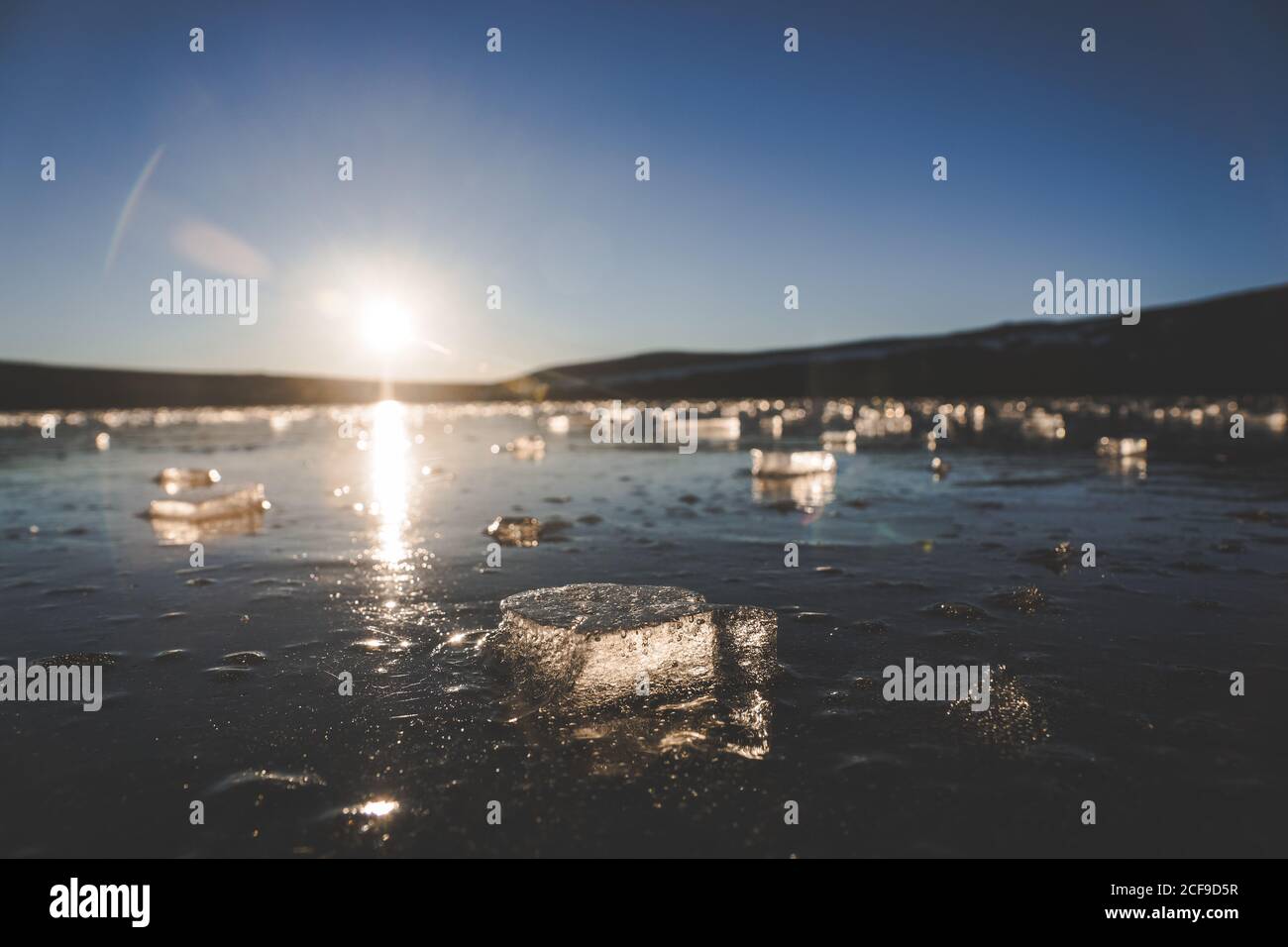 Small pieces of ice floating on calm cool water of Laguna de los Peces ...