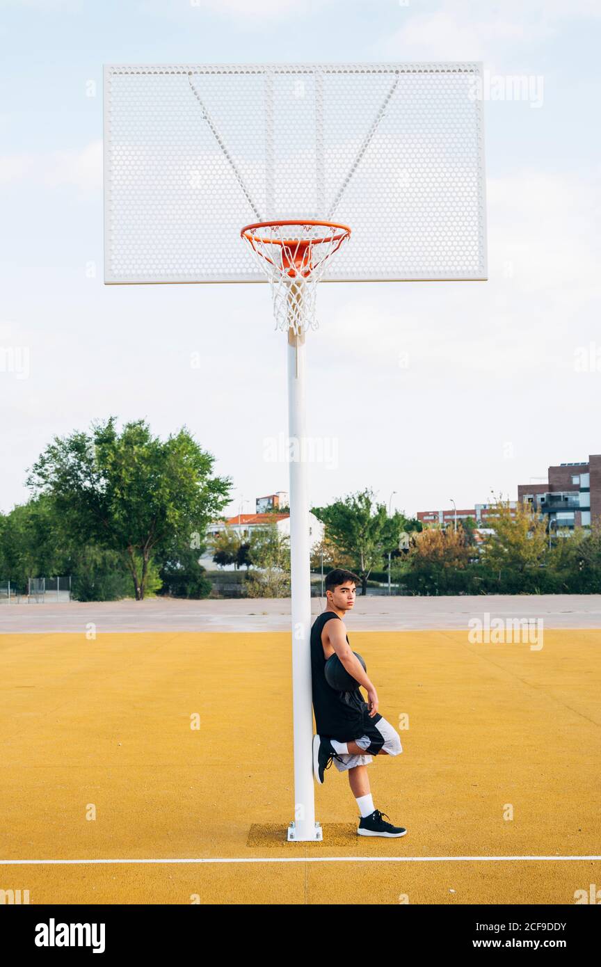 Young man basketball leaning hi-res stock photography and images - Alamy