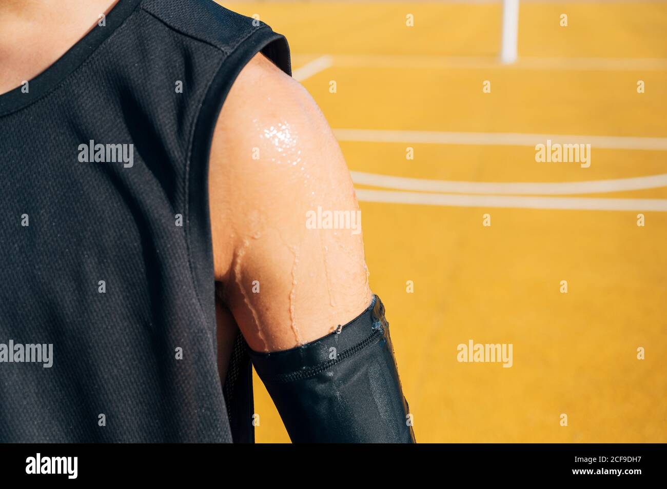 crop shoulder of Young man playing on basketball court outdoor Stock ...