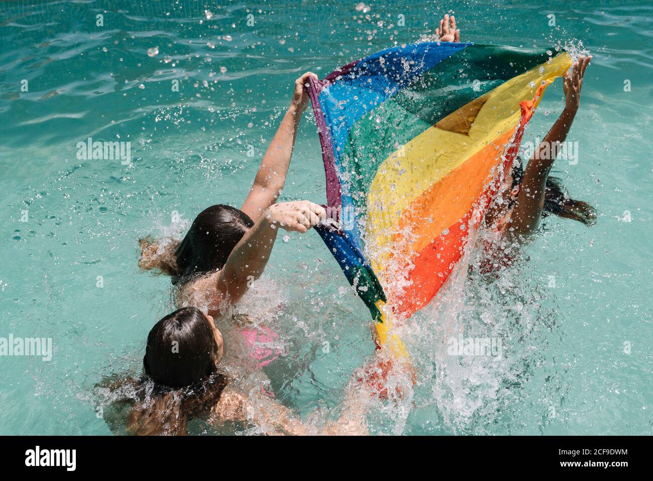 anonymous lesbians splashing in swimming pool Stock Photo - Alamy