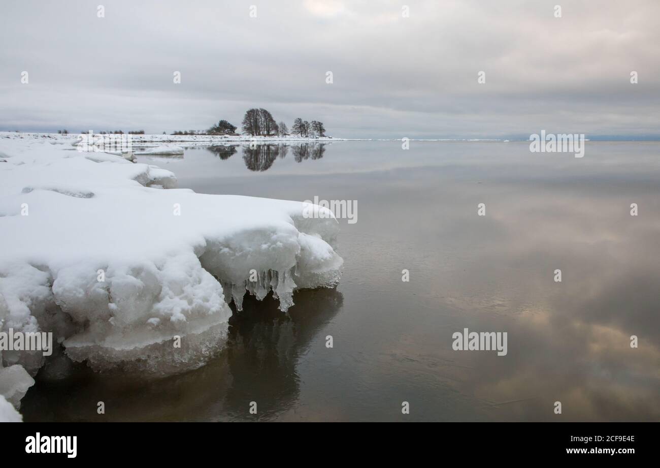 Seascape view on the freezing winter coast with ice formations Stock ...