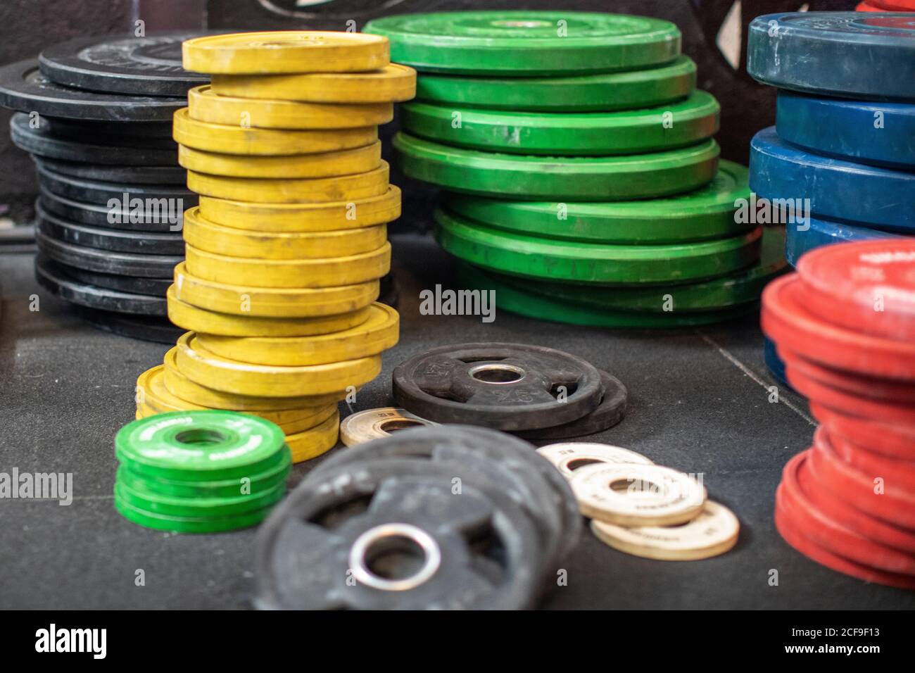Bright weights in gym Stock Photo - Alamy
