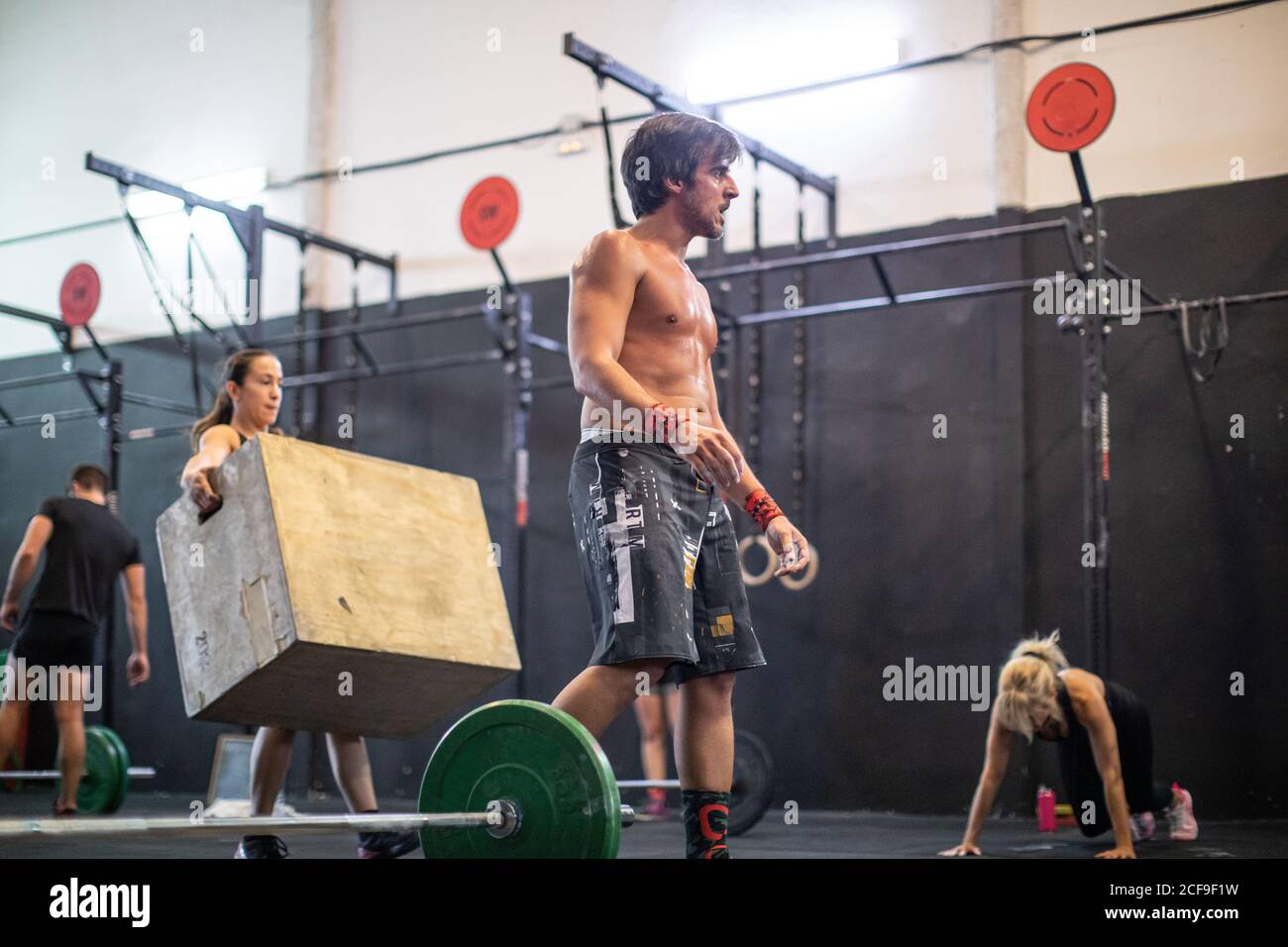 Tired man standing in gym Stock Photo - Alamy