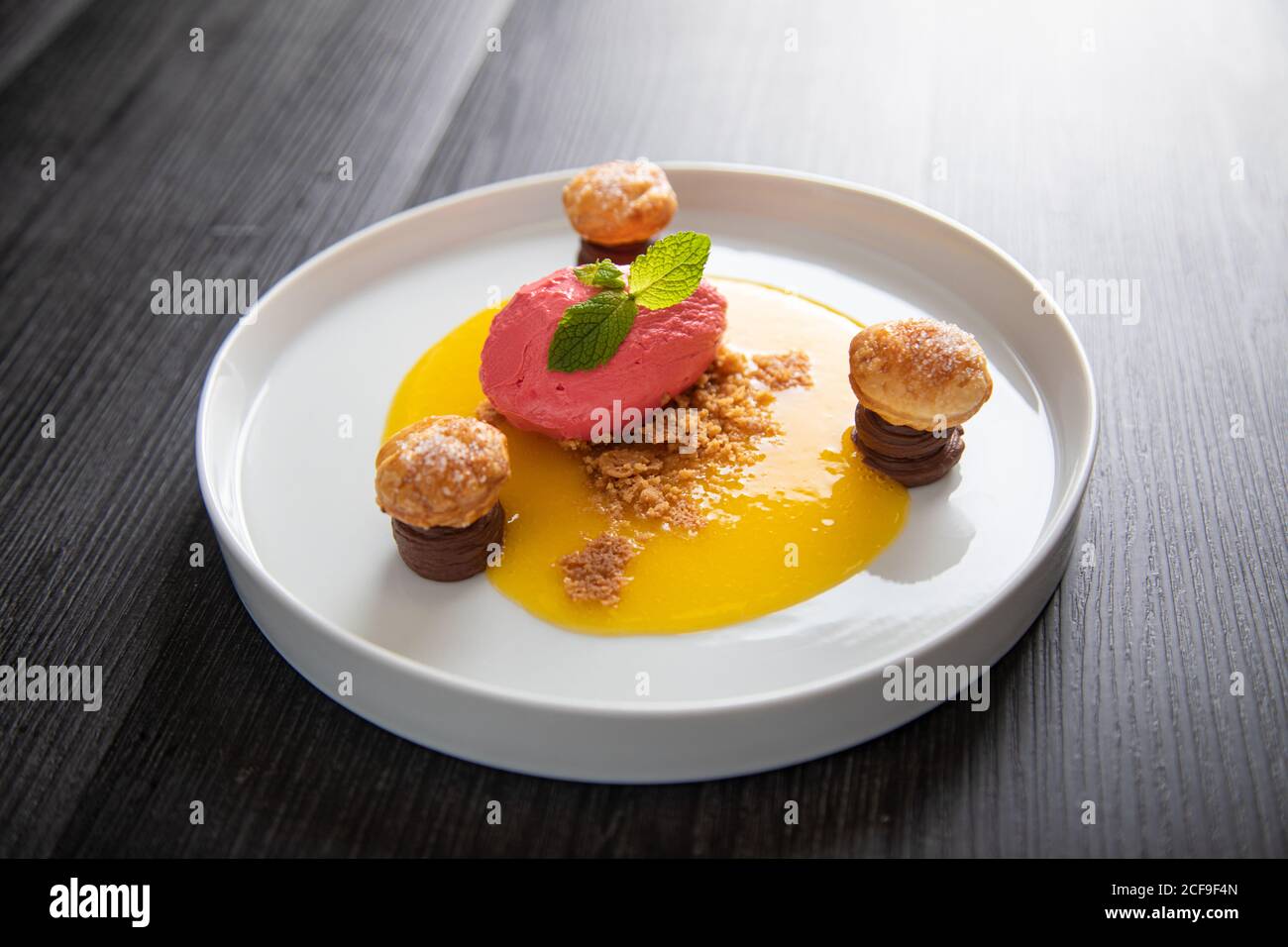 Raspberry ice cream with curable oranges chocolate and puff pastry ...