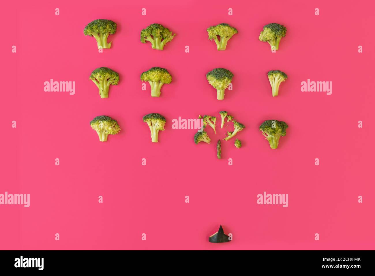 Top view of ripe green broccoli with crushed one arranged in rows near ...