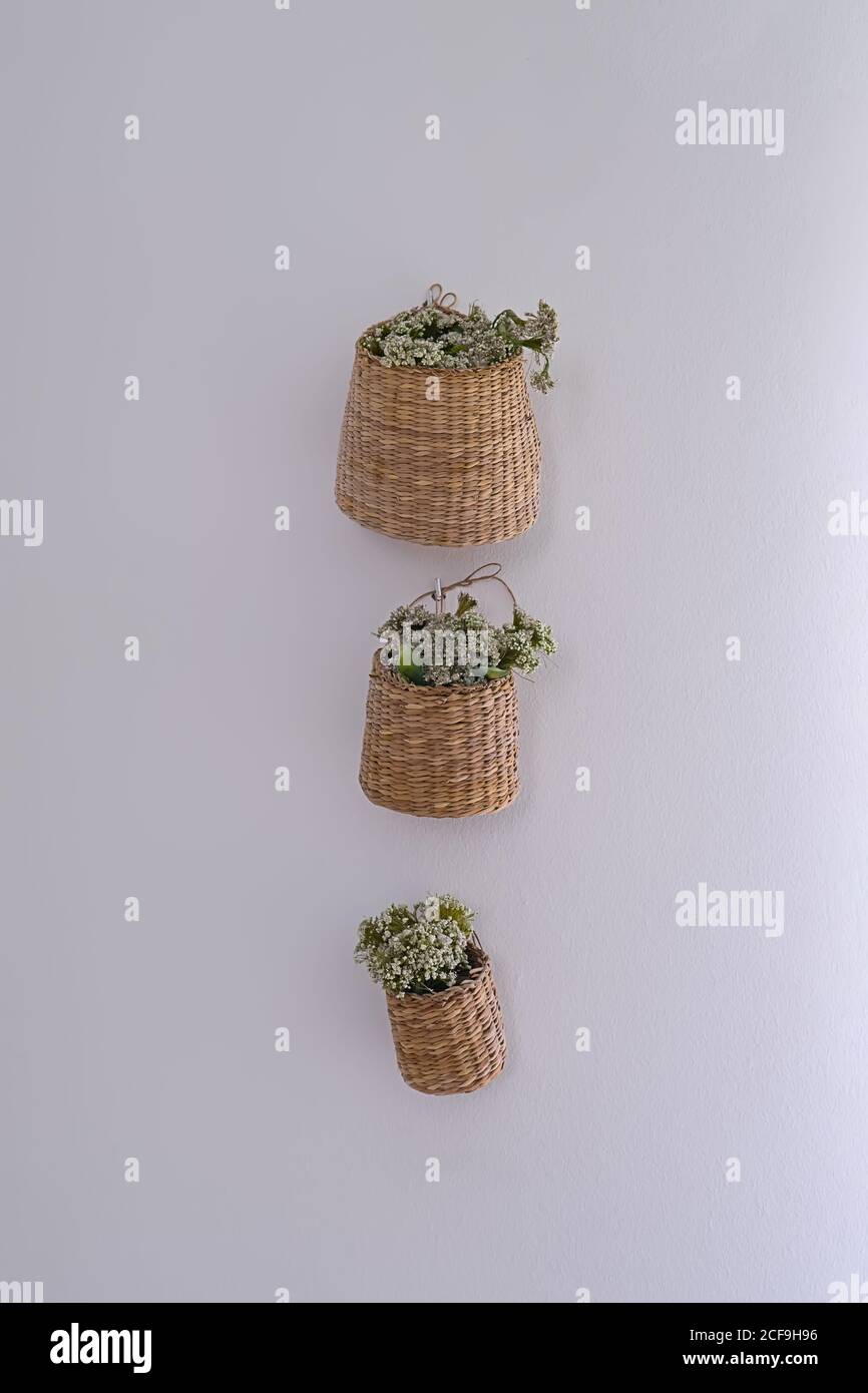 Willow wicker storage baskets with flower. Set of three wicker baskets ...