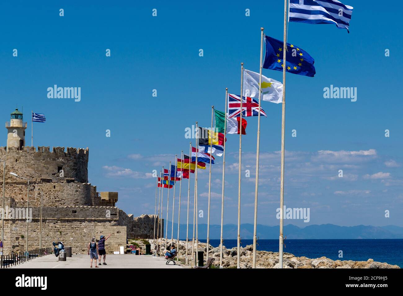 Harbour flag poles. Rhodes town, Dodecanese Islands, Greece Stock Photo ...
