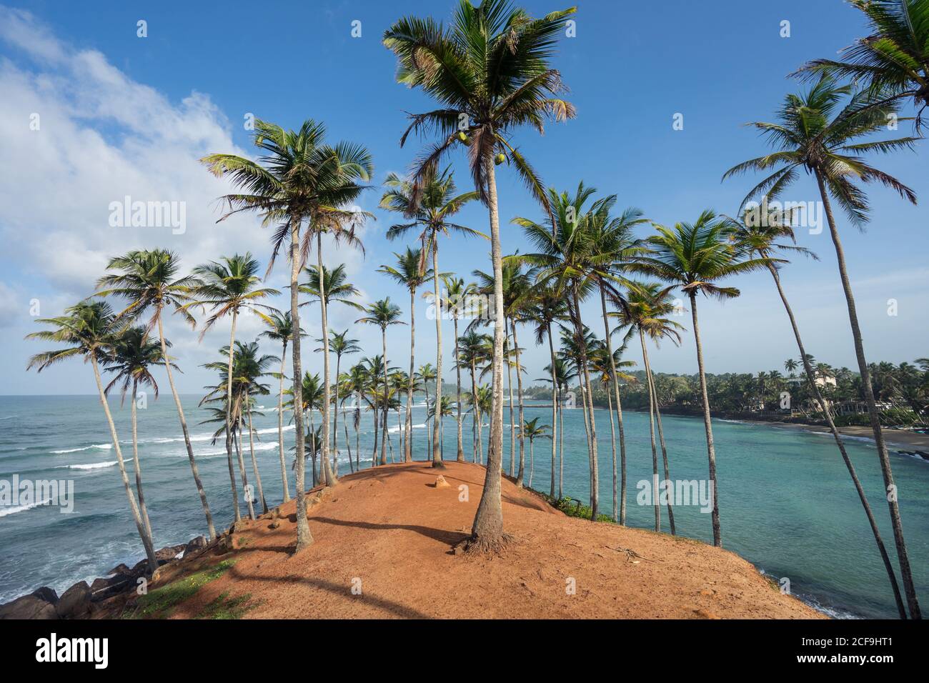 Calm landscape of tropical small island with palm trees on beach and ...