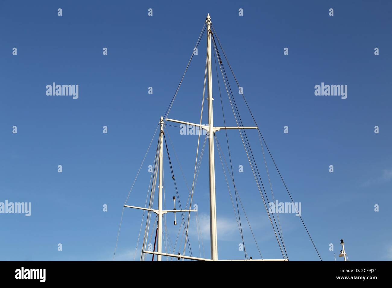 White yacht masts against the blue sky Stock Photo - Alamy