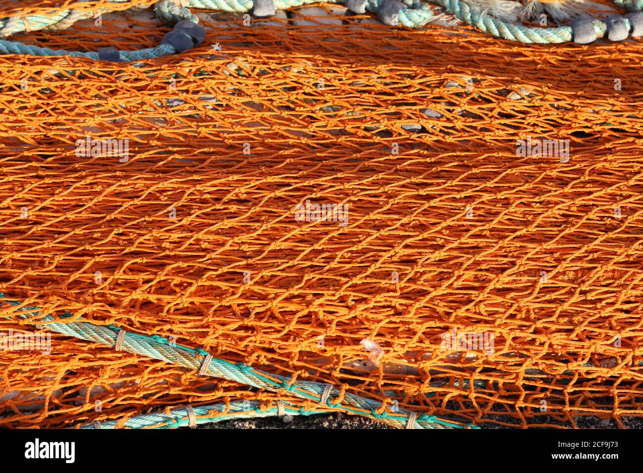 Red net lies on the beach Stock Photo - Alamy