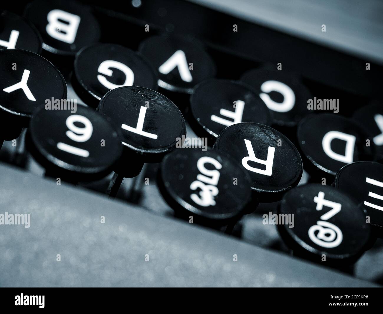 Typewriter keyboard, view from above in blue tone Stock Photo - Alamy