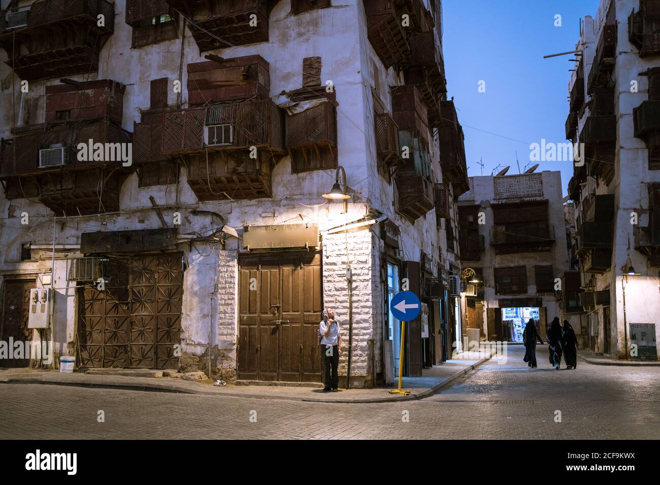 Typical residential stone buildings with shabby walls and balconies on ...
