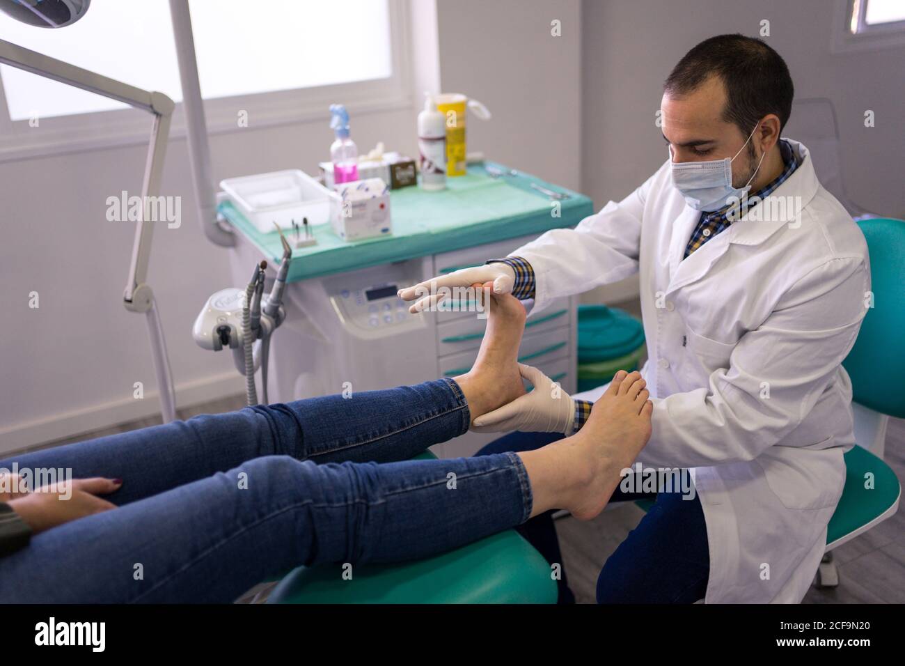 Doctor examining feet hi-res stock photography and images - Alamy