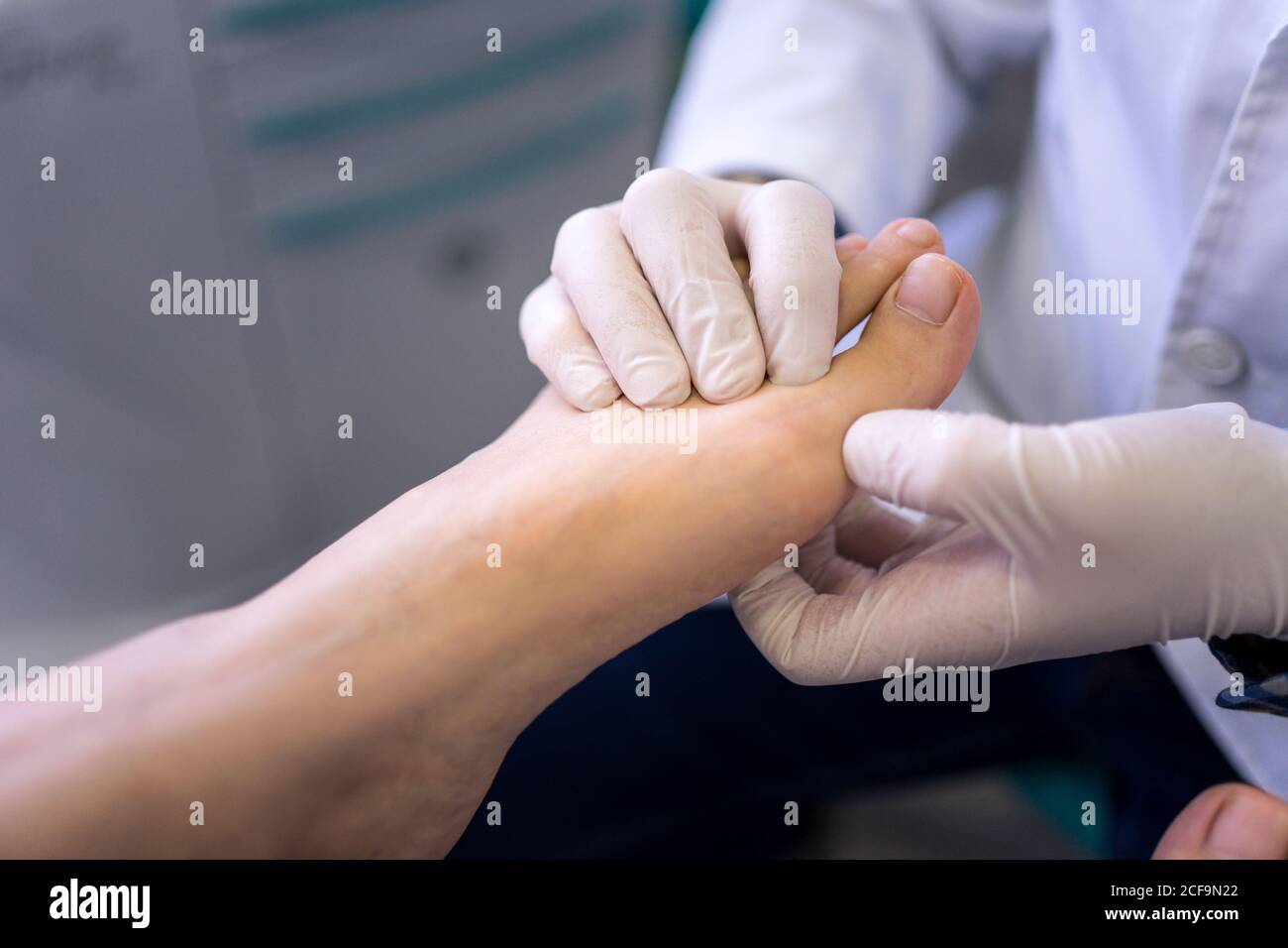 Podiatrist examining foot patient hi-res stock photography and images ...