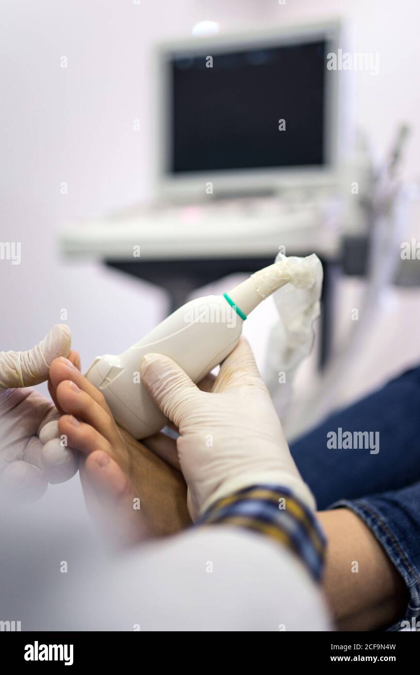 Podiatry doctor using ultrasound scanner Stock Photo - Alamy