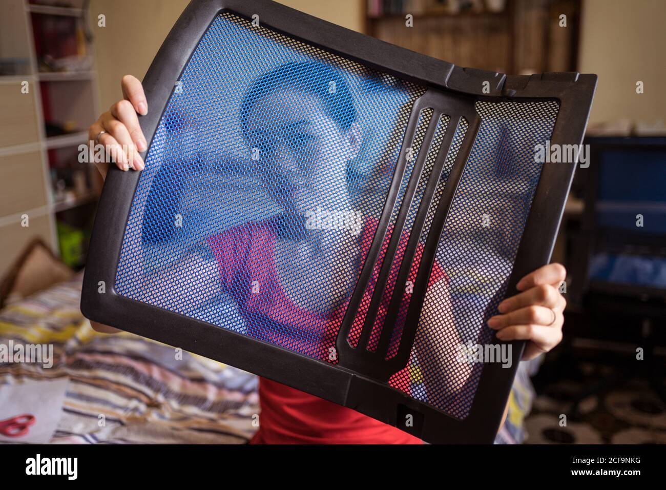 Ethnic Asian female checking plastic chair back with net fabric while ...