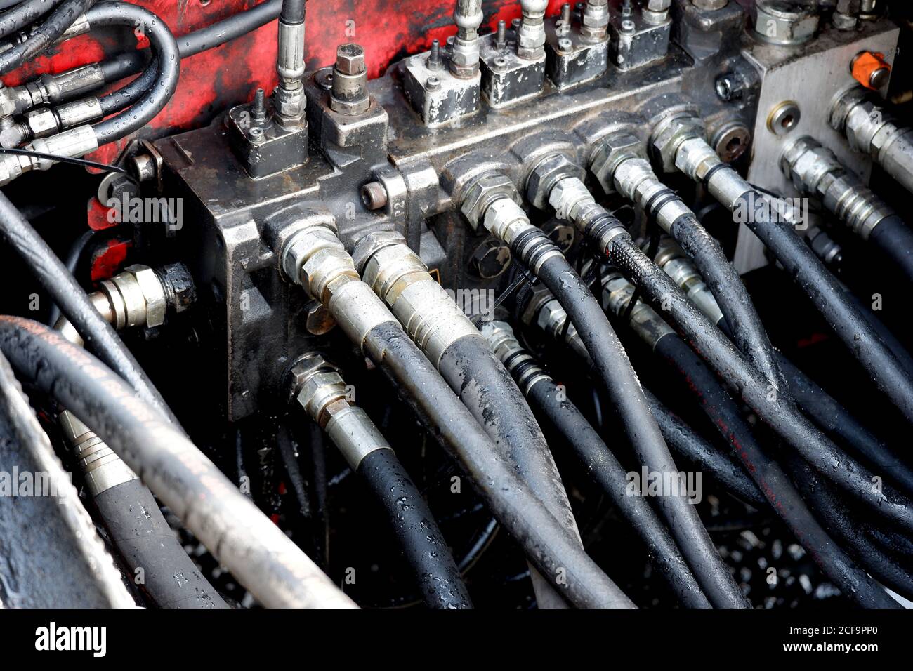 Hydraulic valve piping systems in machinery Stock Photo - Alamy