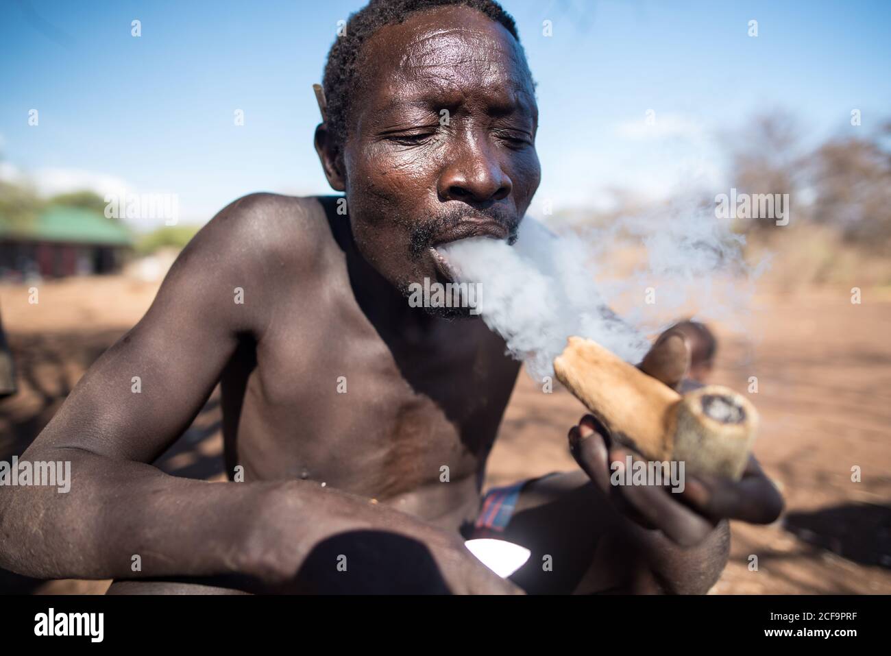 Tanzania, East Africa - November, 2016: Shirtless African men blowing ...