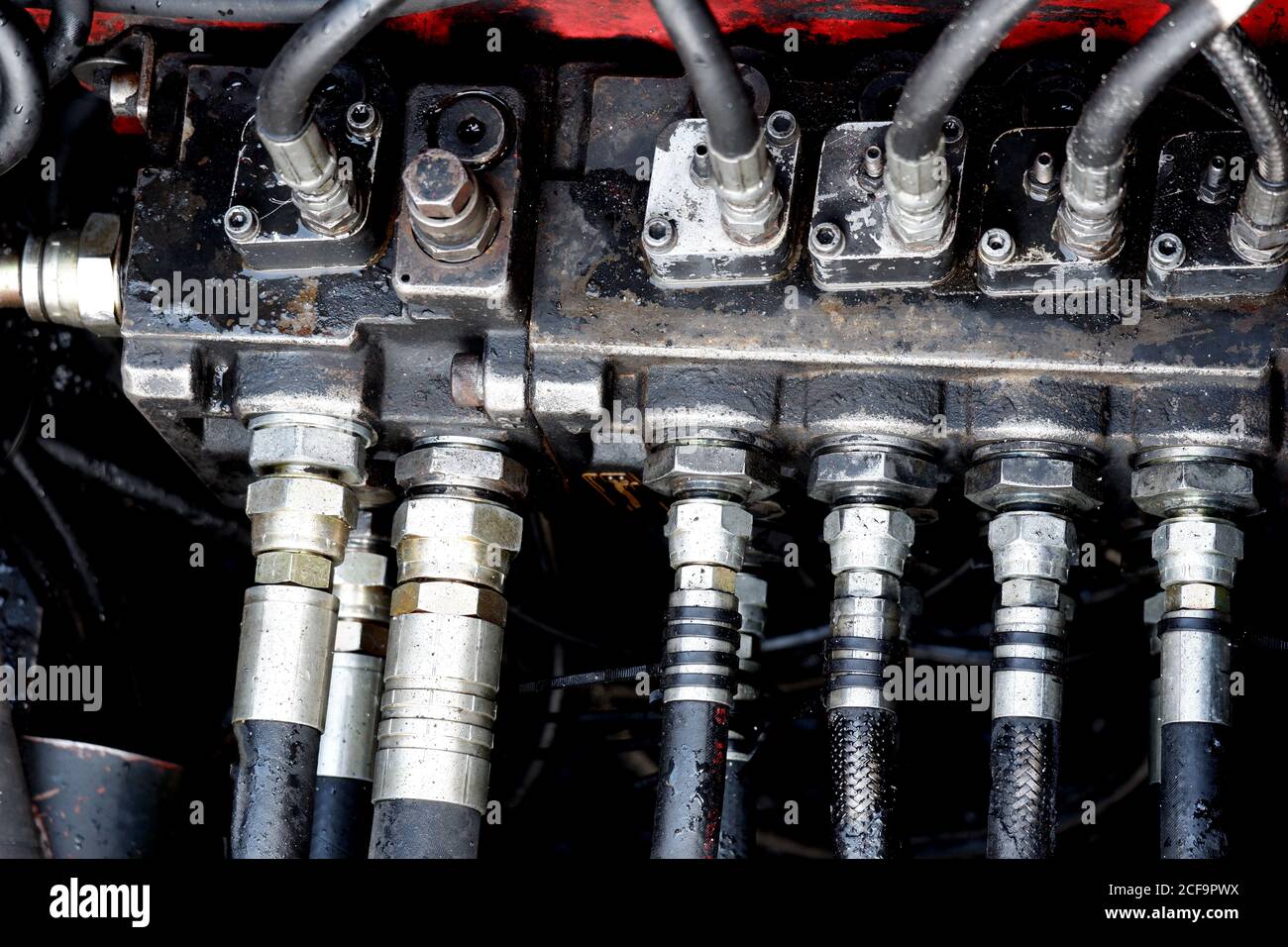 Hydraulic valve piping systems in machinery Stock Photo - Alamy