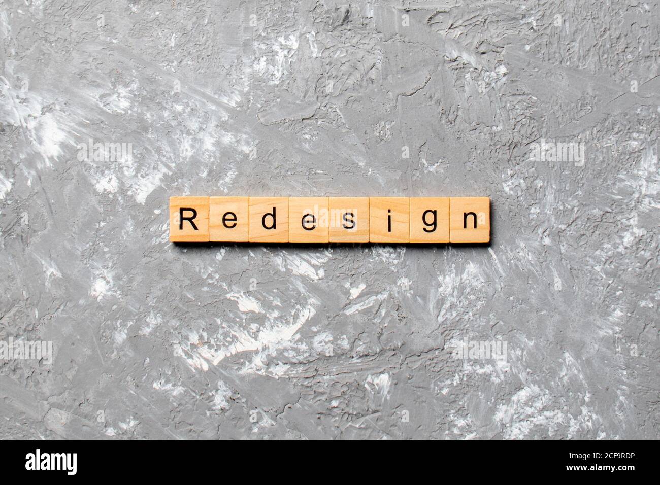 REDESIGN word made with wooden blocks concept Stock Photo - Alamy