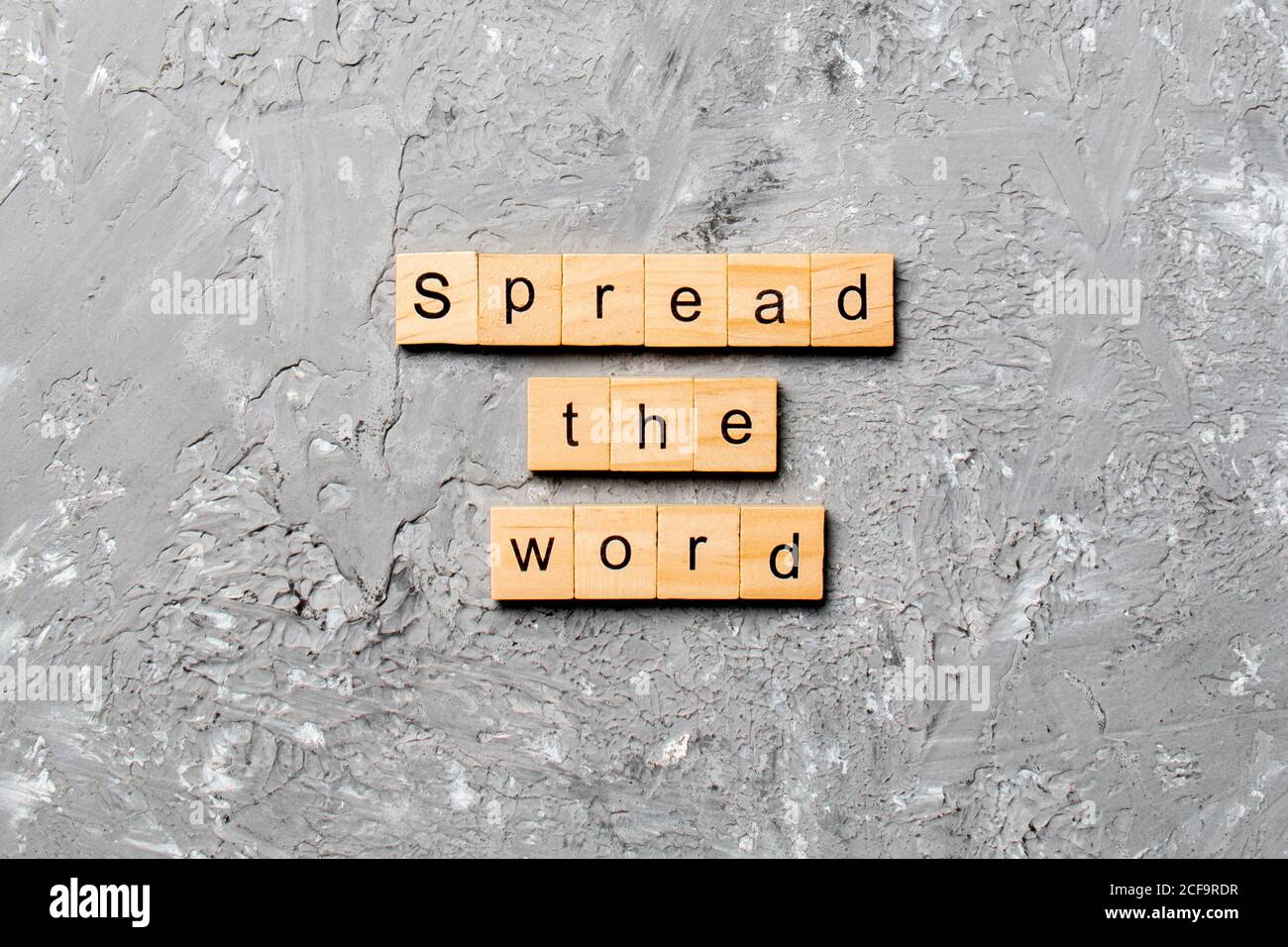 Spread the word word written on wood block. Spread the word text on ...