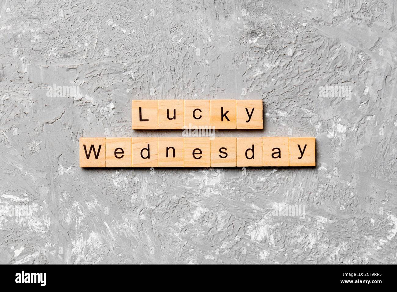 lucky wednesday word written on wood block. lucky wednesday text on ...