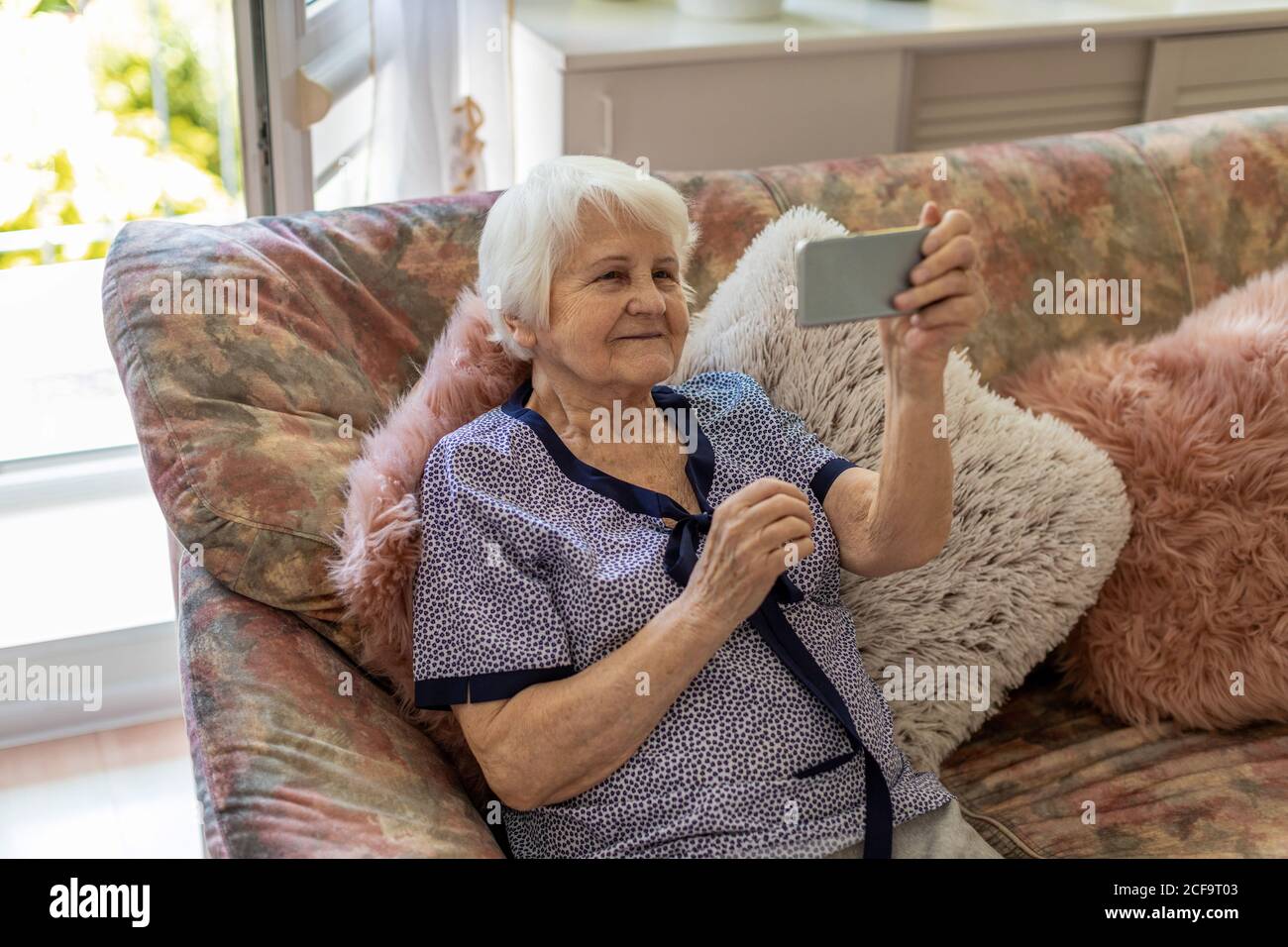 Home smartphone woman internet hi-res stock photography and images - Alamy