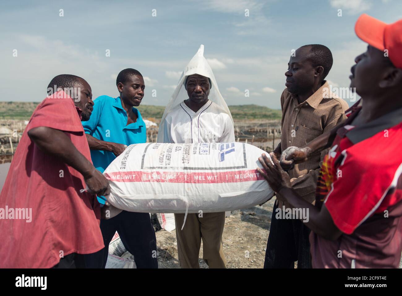 African people helping white hi-res stock photography and images - Alamy