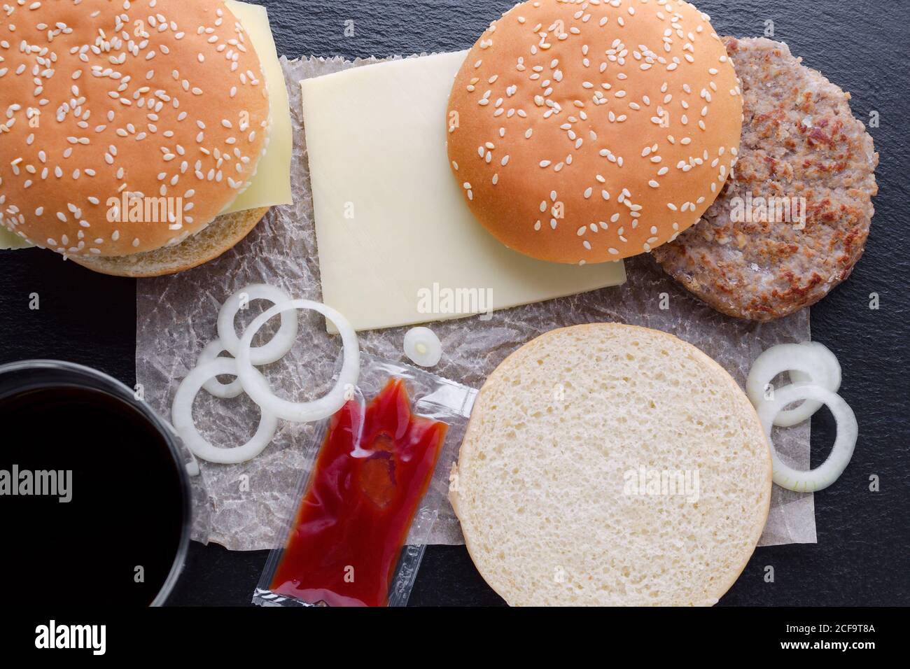 preparation of homemade burger on black background, flat lay Stock ...
