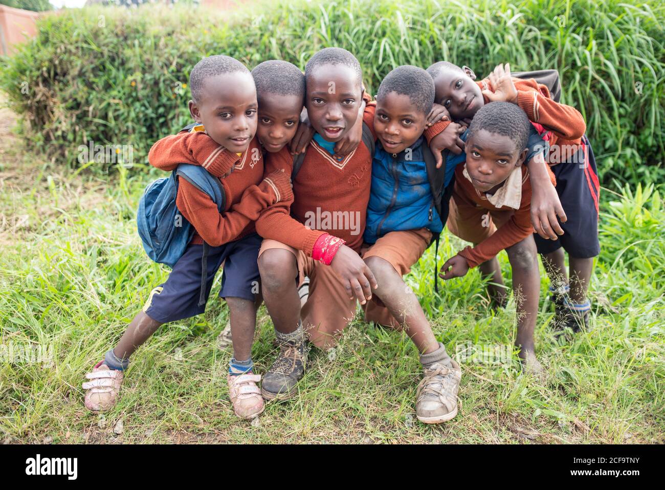 Uganda - November, 26 2016: African kids with school uniform hugging ...