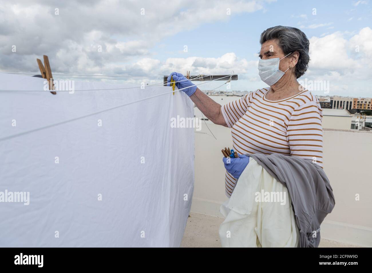 Woman taking clothes off hi-res stock photography and images - Alamy