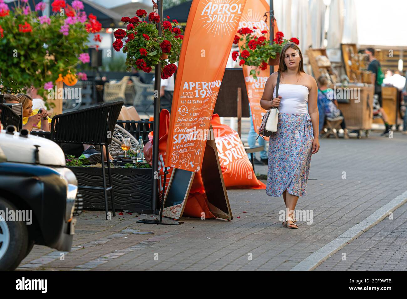 Riga, Latvia - August 21, 2020: a young woman dressed in a light top ...