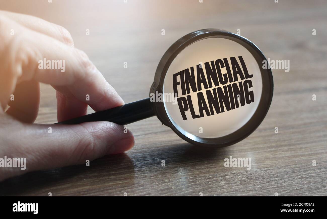 Financial planning under magnifying glass. Business and finance concept ...