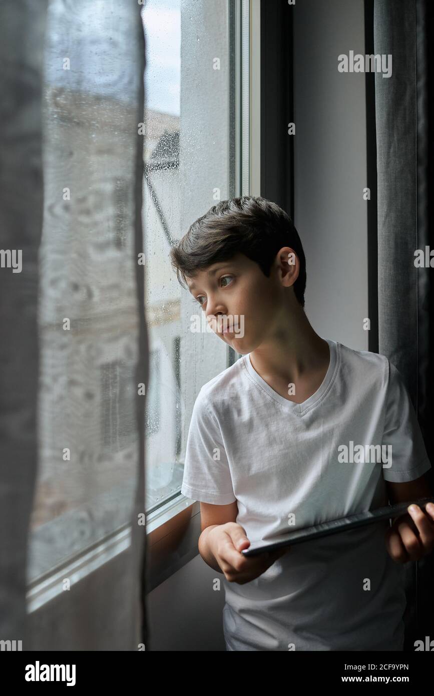 Bored Child Looking Out Window