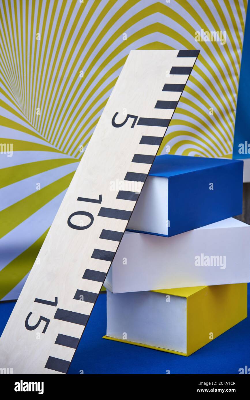 Layout of a stack of large books and a ruler, concept of learning at ...
