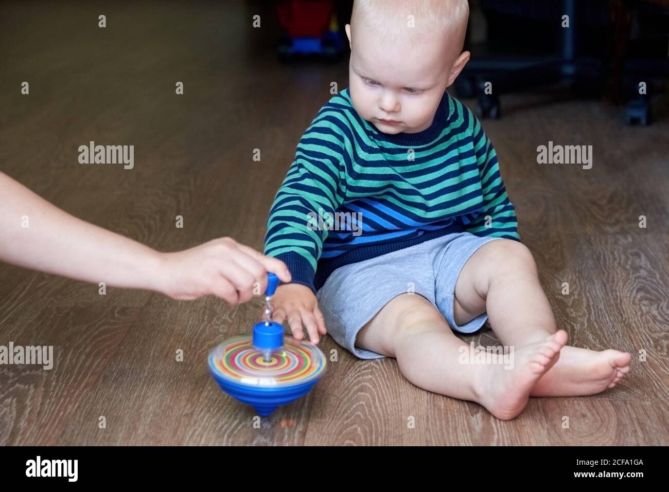 Boy playing spinning top hi-res stock photography and images - Alamy