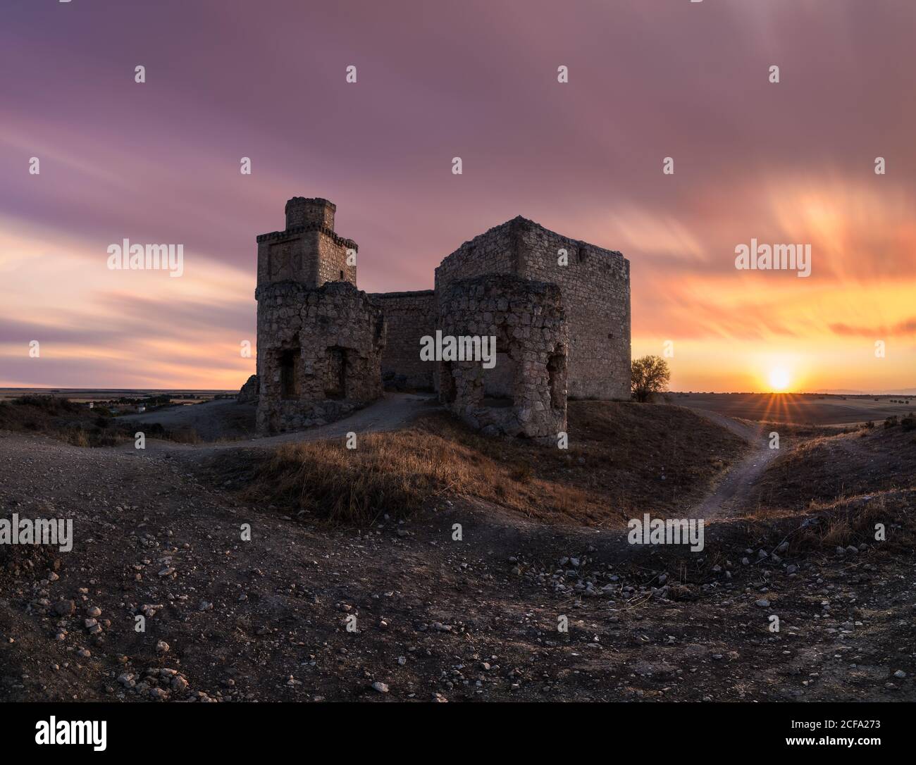 Sightseeing medieval ruined castle against cloudy sundown sky in ...