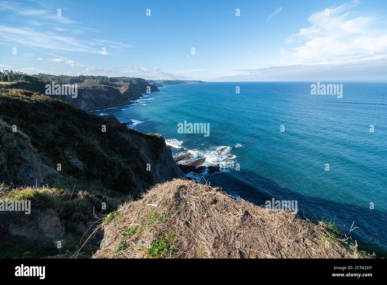From above amazing seascape and cliff coastline with clear blue sky in ...