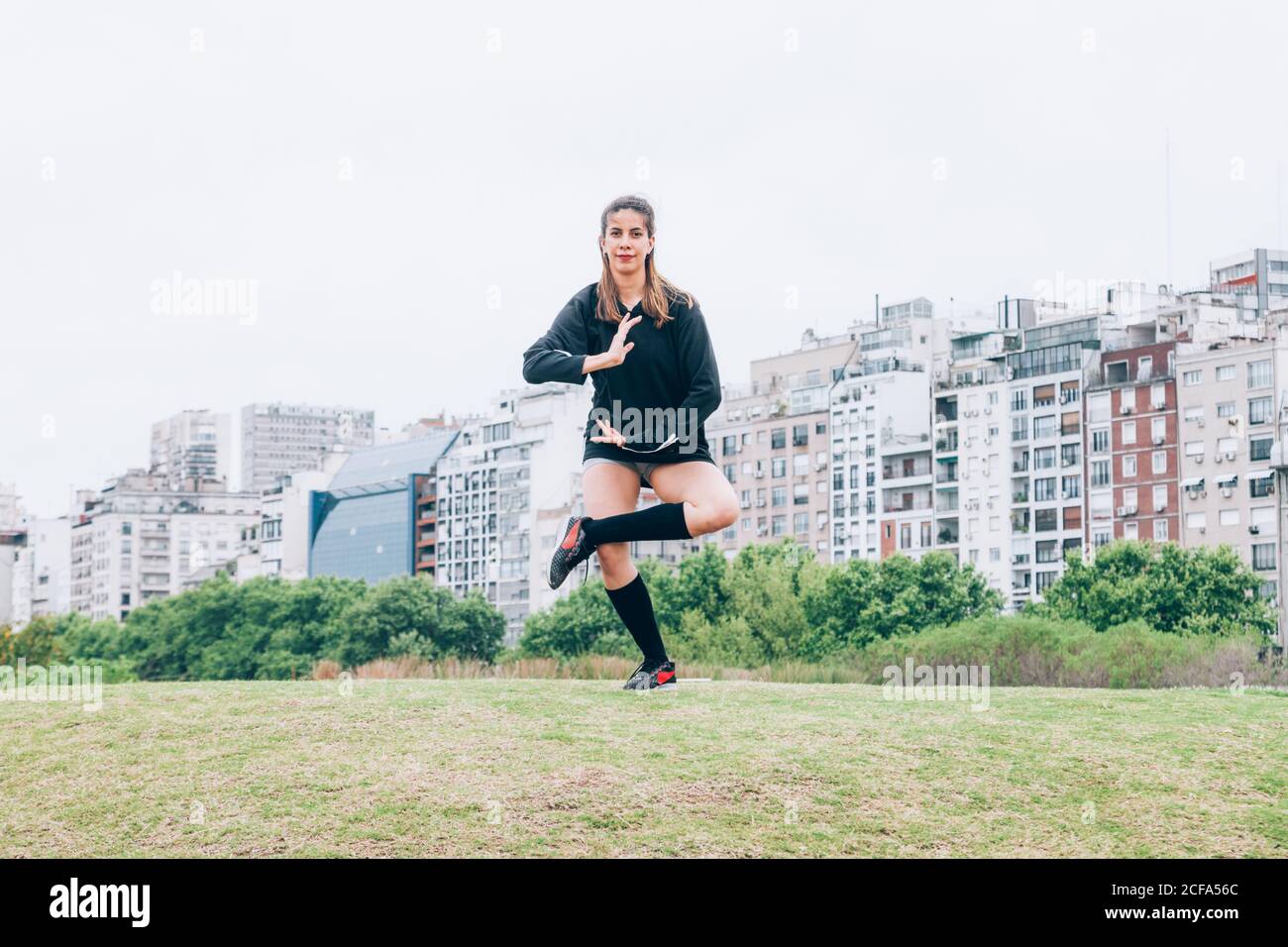 Legs crossed standing hi-res stock photography and images - Alamy